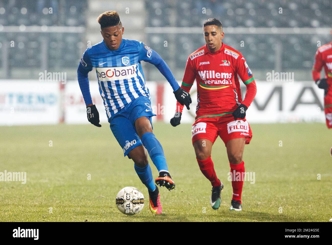 Genk's Leon Bailey and Oostende's Yassine El Ghanassy fight for the ...