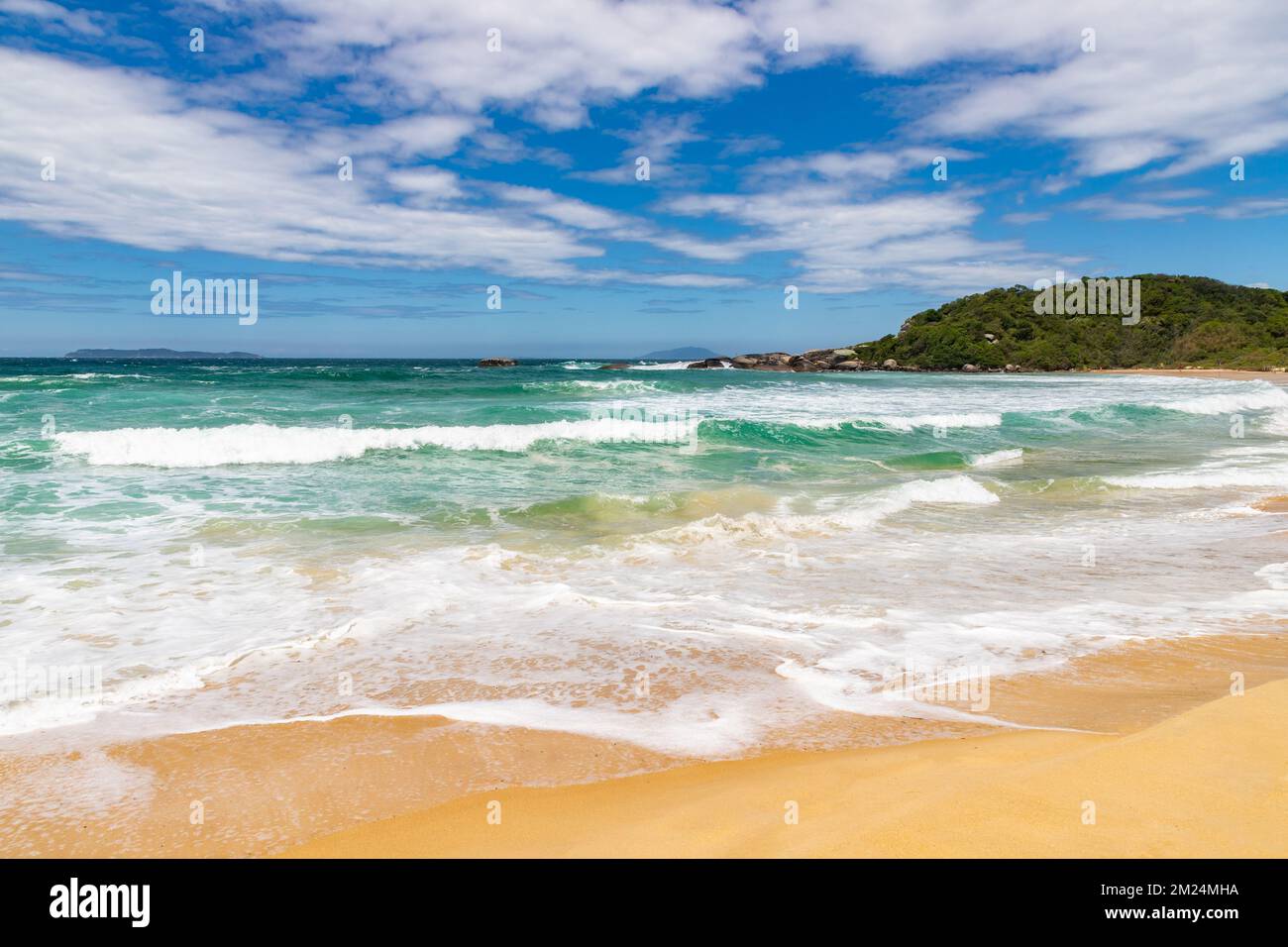 Sand and waves in Quatro Ilhas beach, Bombinhas, Santa Catarina, Brazil ...