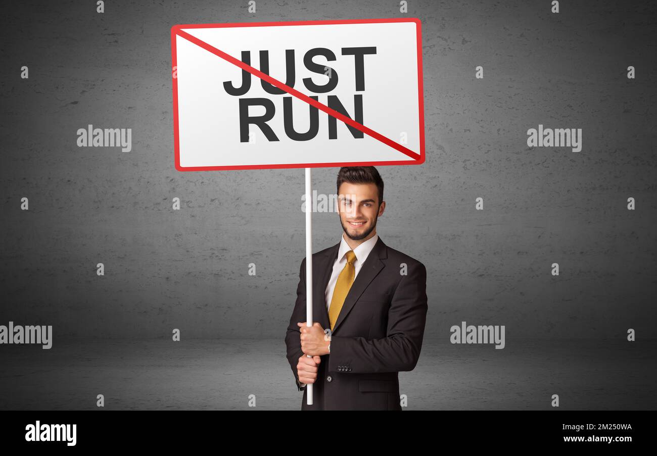 business person holding a traffic sign Stock Photo - Alamy