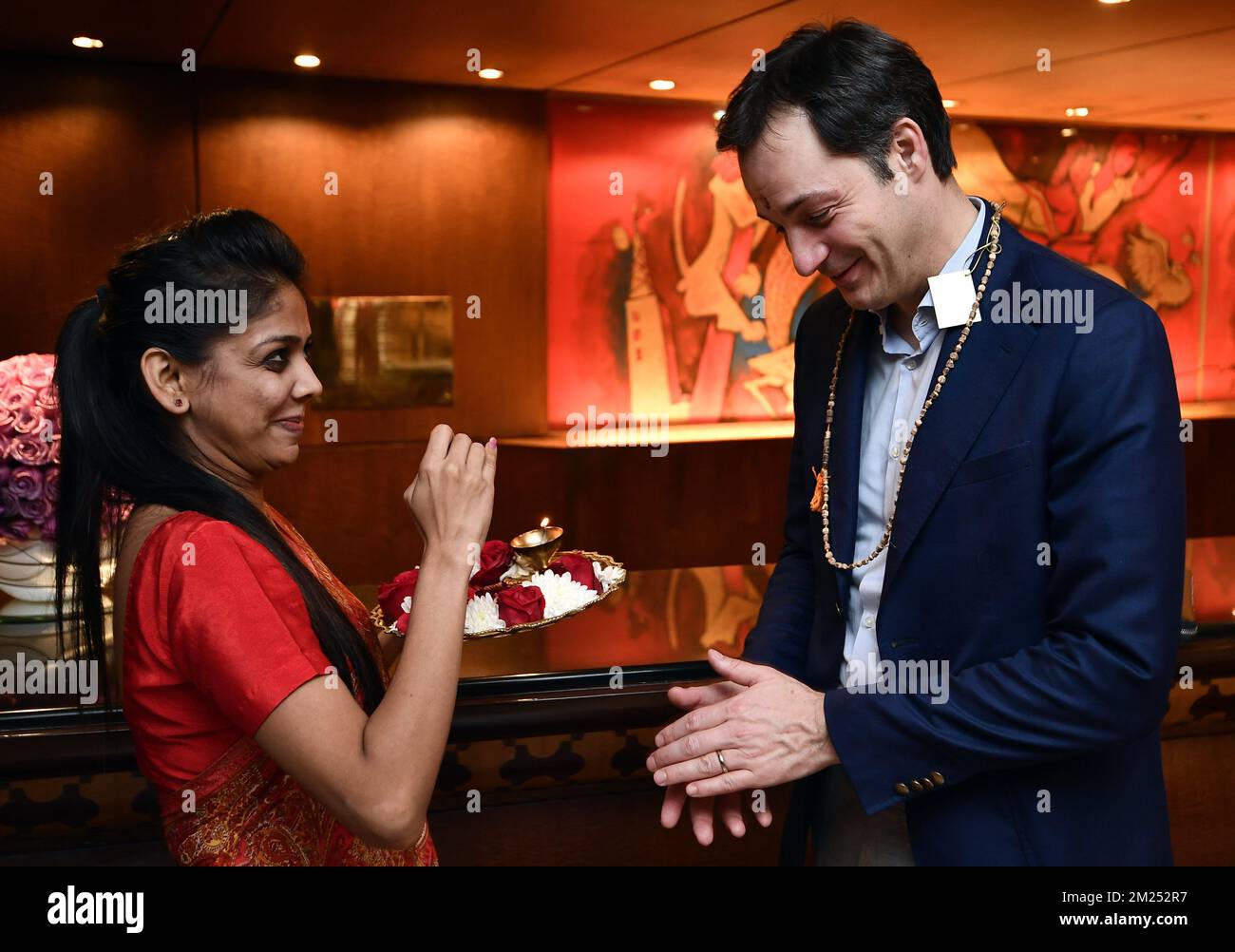 A woman makes the traditional Indian welcome ceremony upon the arrival ...