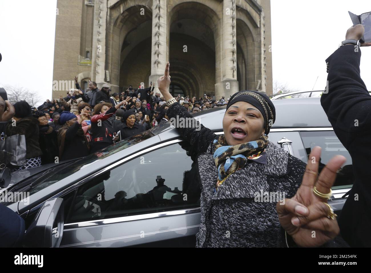 Lots of people of the Congolese community surrounded the hearse with ...