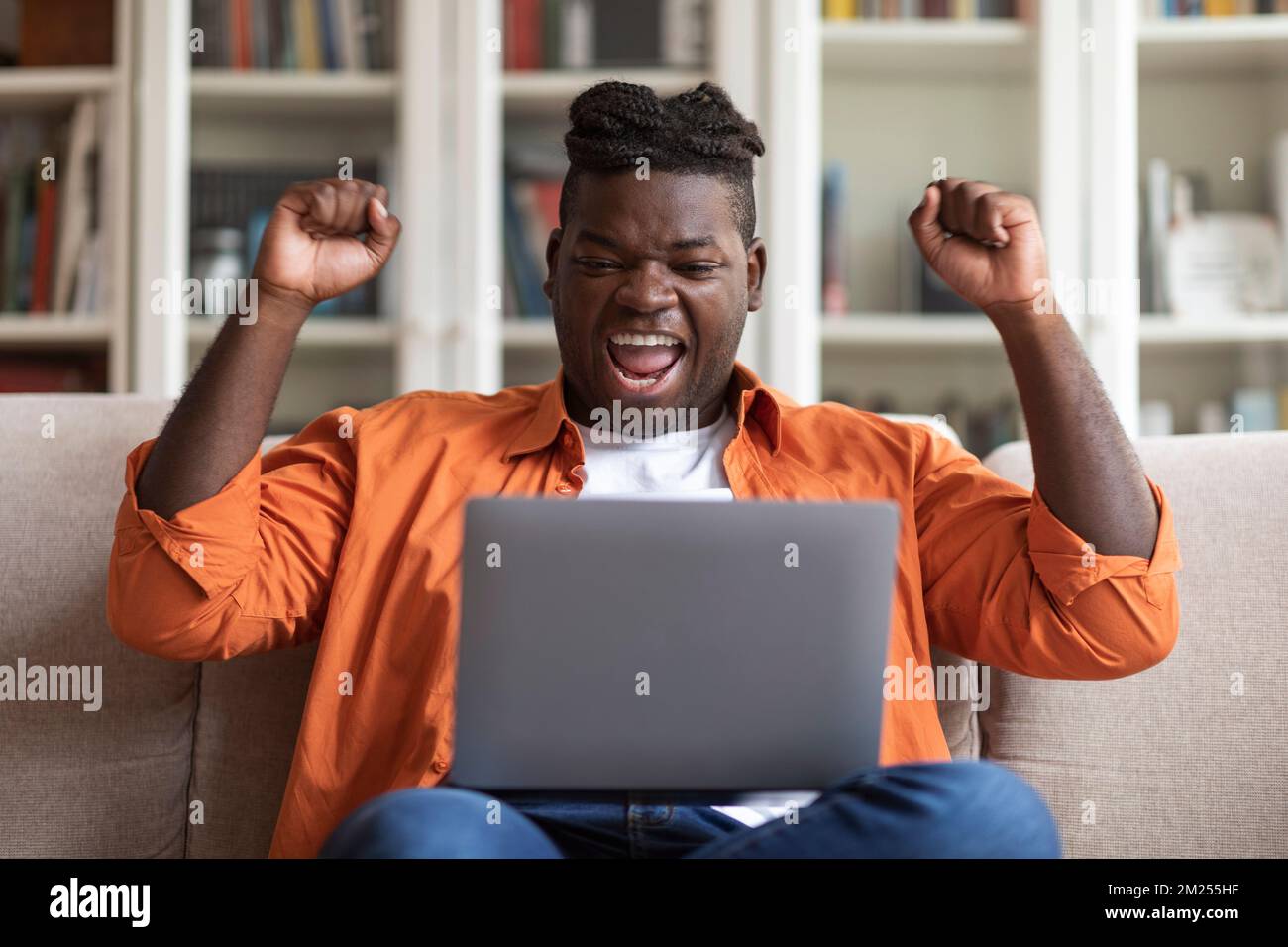Young adult man celebrating online hi-res stock photography and images ...