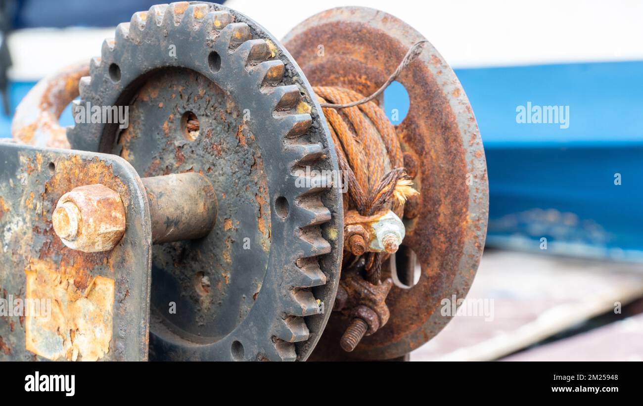 Rusty chains and rope. rope winding machine. nautical instruments ...