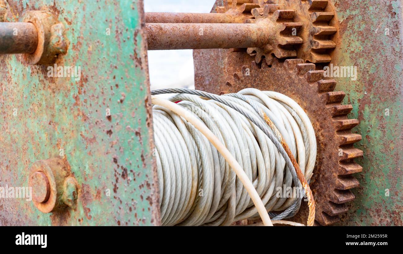 Rusty chains and rope. rope winding machine. nautical instruments ...