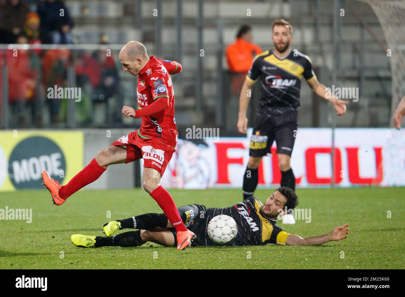 Oostende's Franck Berrier and Lokeren's Koen Persoons fight for the ...