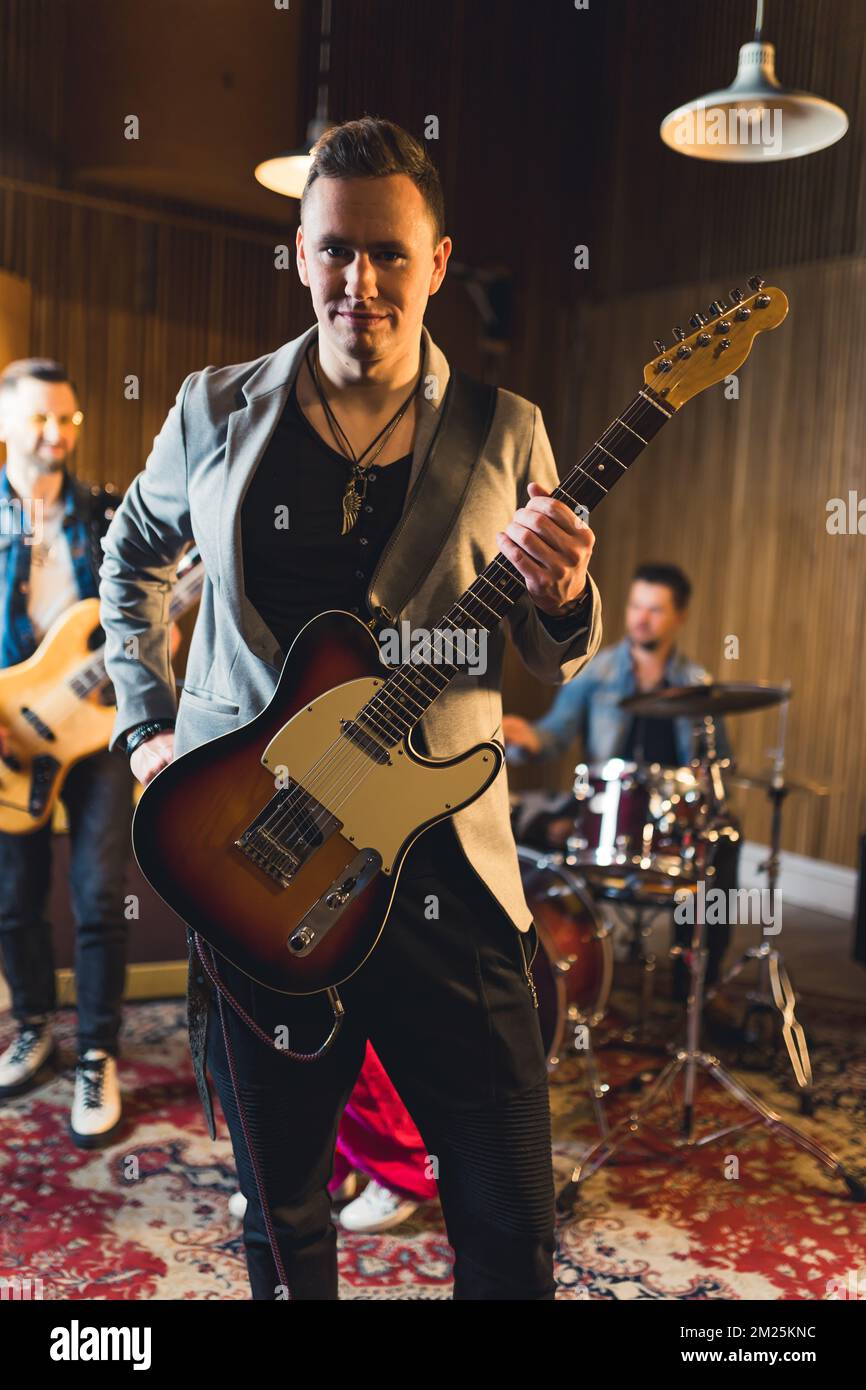 music band guitarist performing repetition with his band in the ...
