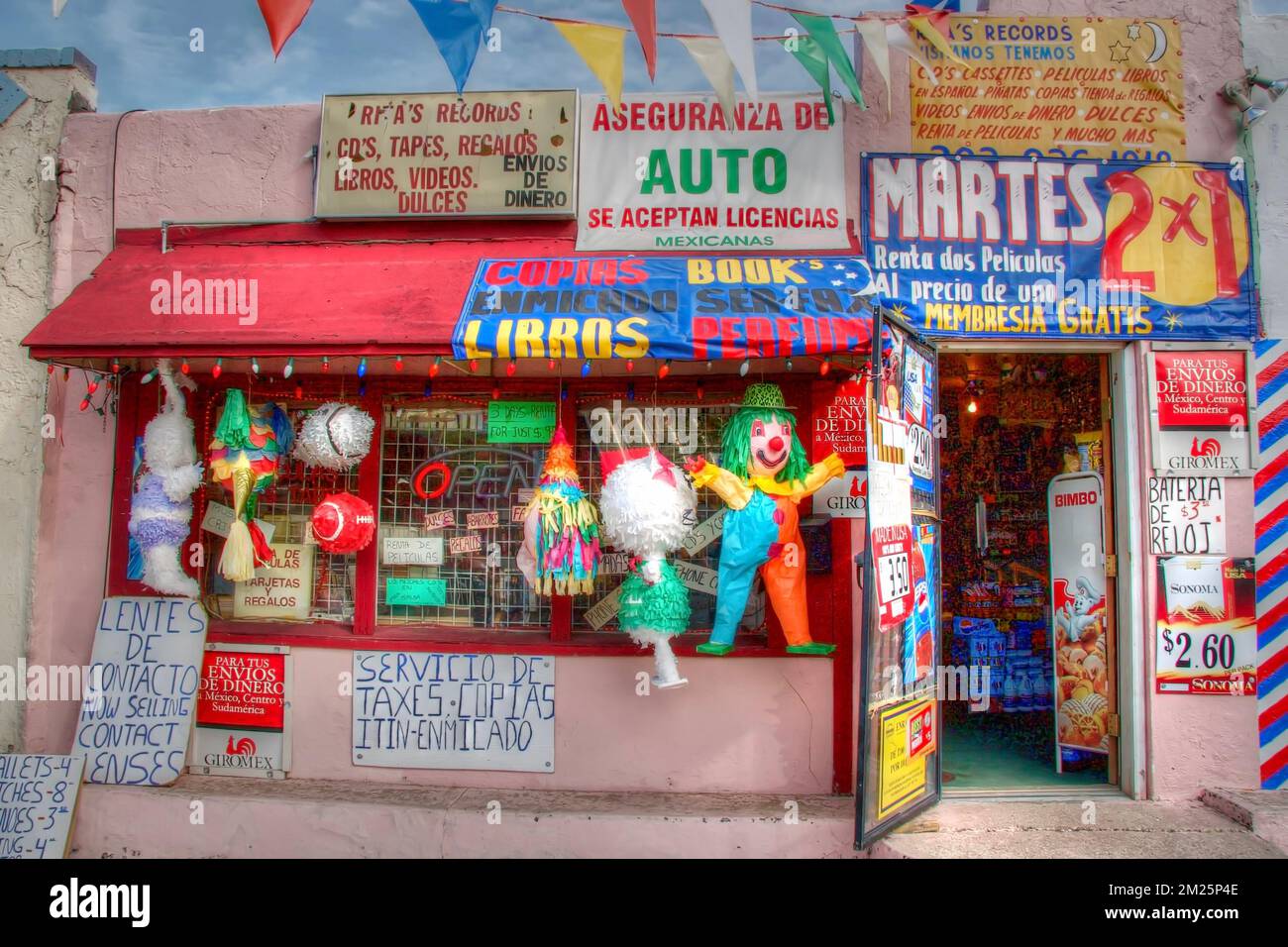 A charming hispanic storefront with signs offering an extensive variety ...