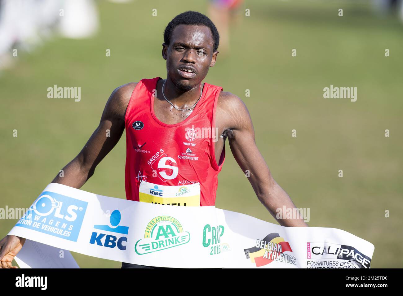 Belgian Isaac Kimeli celebrates as he crosses the finish line to win ...