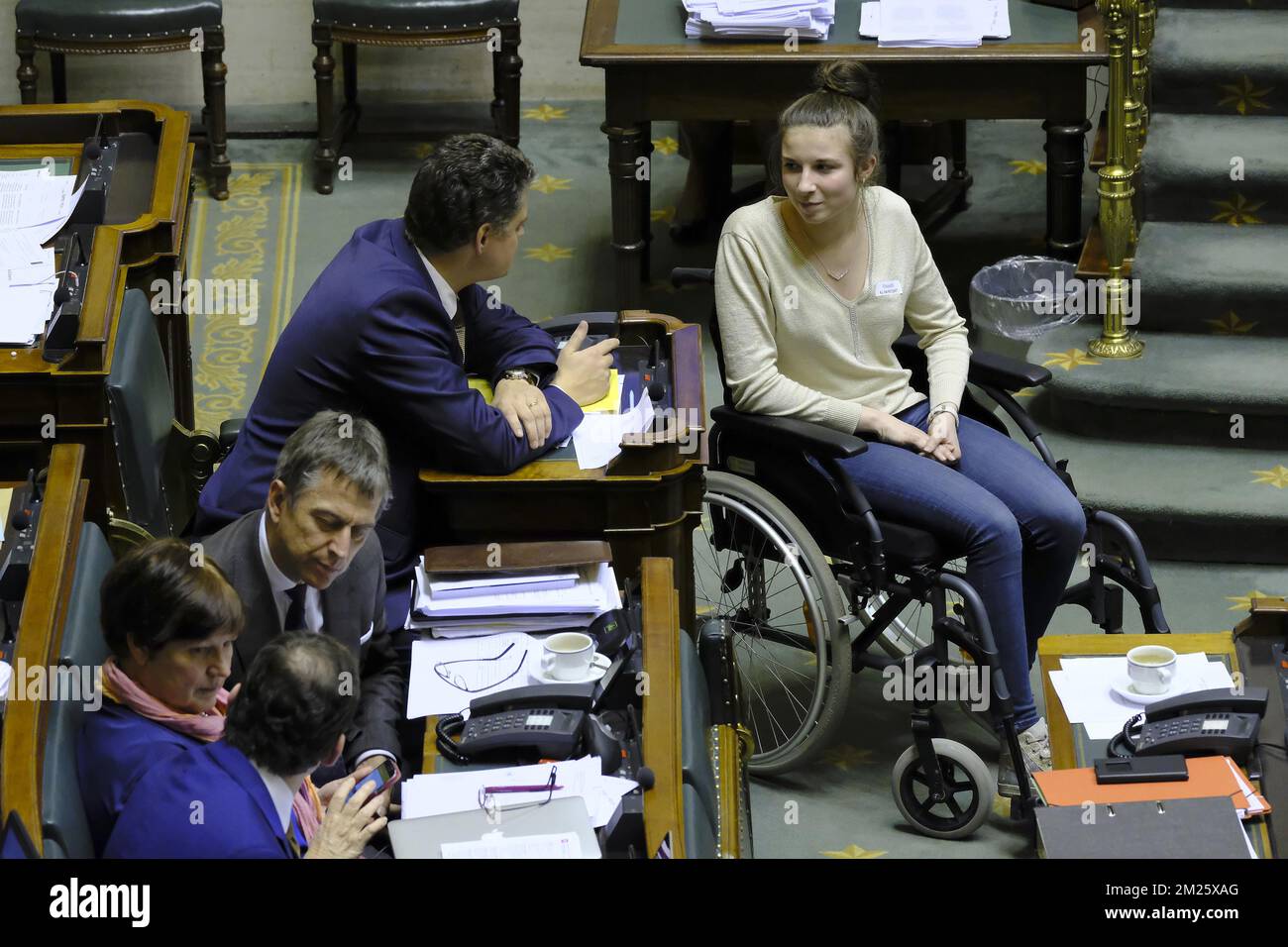Visitor in a wheelchair pictured during a plenary session of the ...
