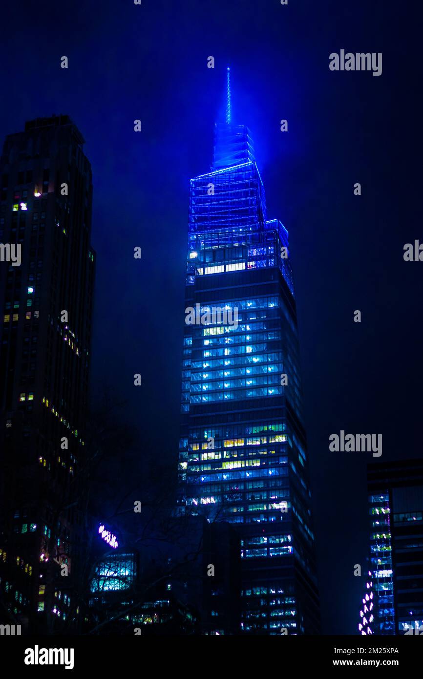 A vertical night shot of illuminated summit one Vanderbilt tower in New ...