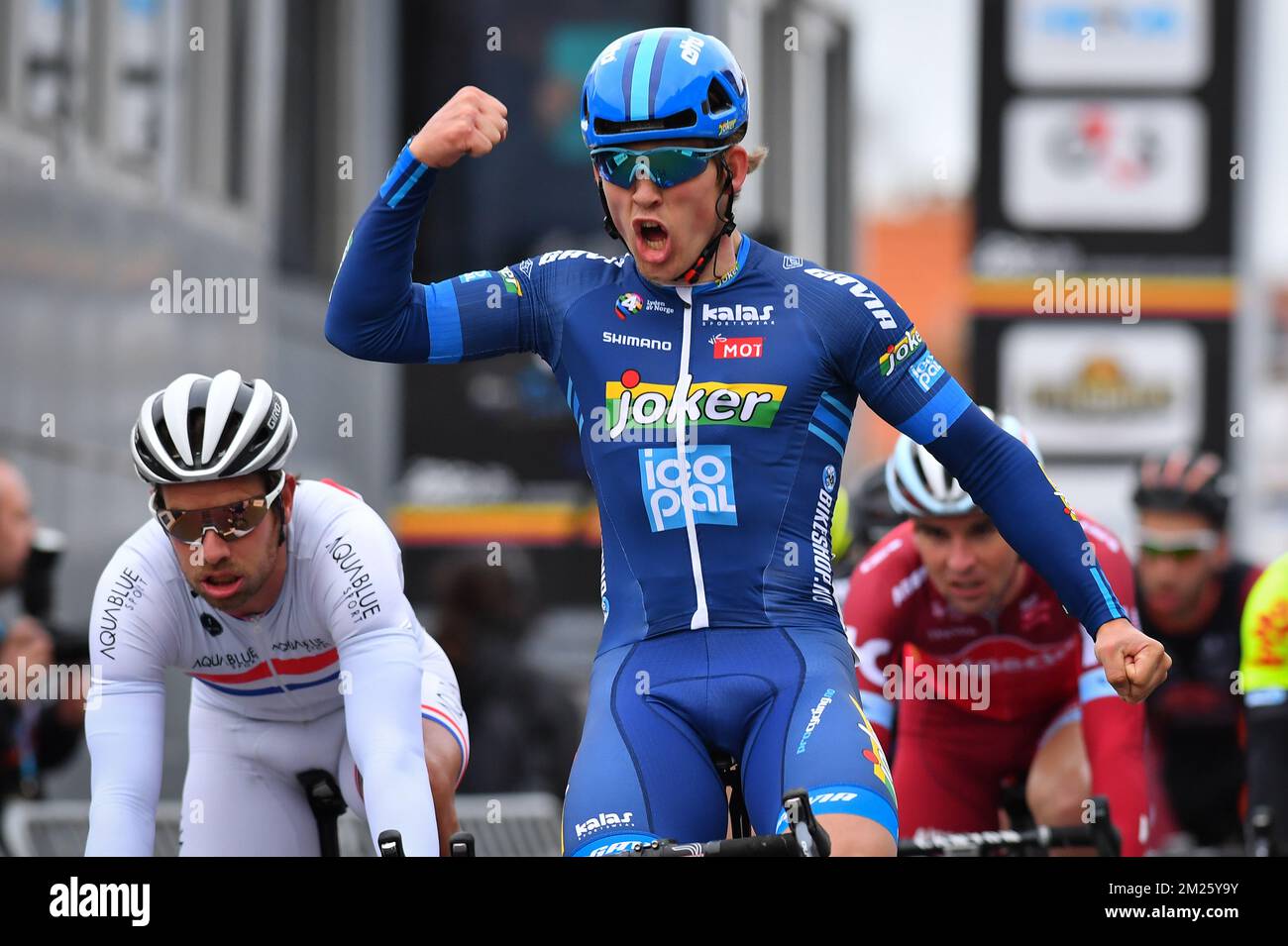 Norwegian Kristoffer Halvorsen celebrates as he crosses the finish line ...