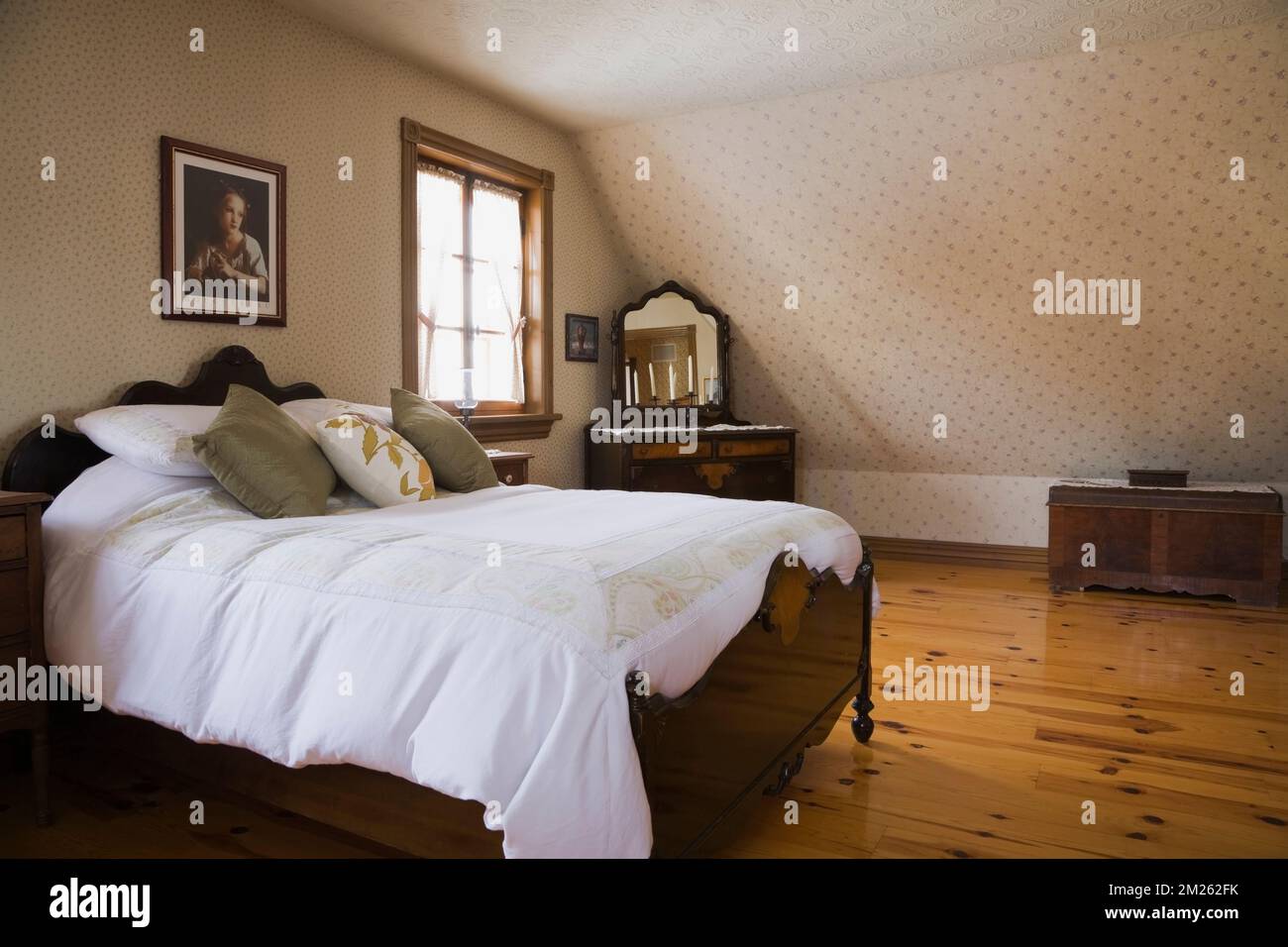 Double wood frame bed in master bedroom on upstairs floor inside old ...