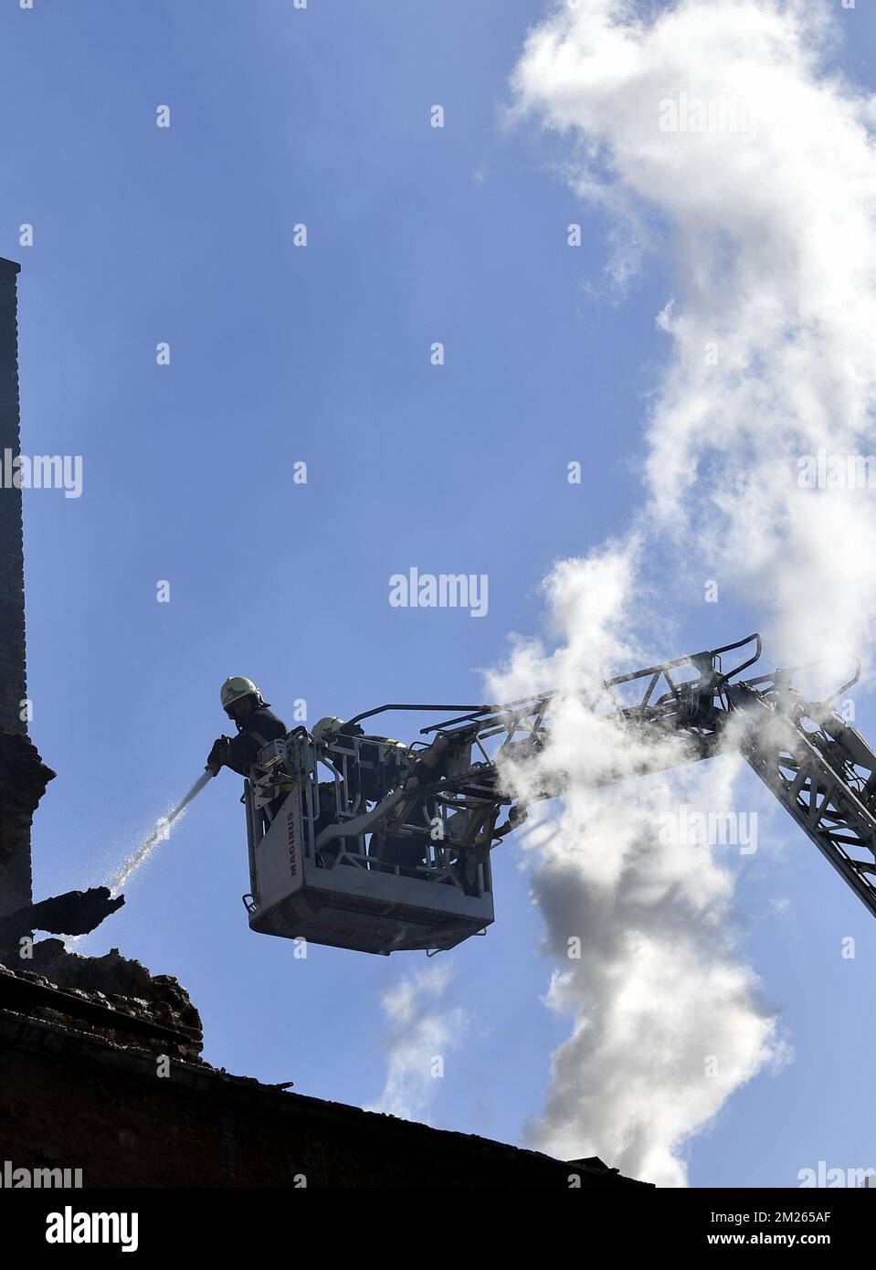 Firefighters pictured in action on the scene of a fire in the 'Chateau ...