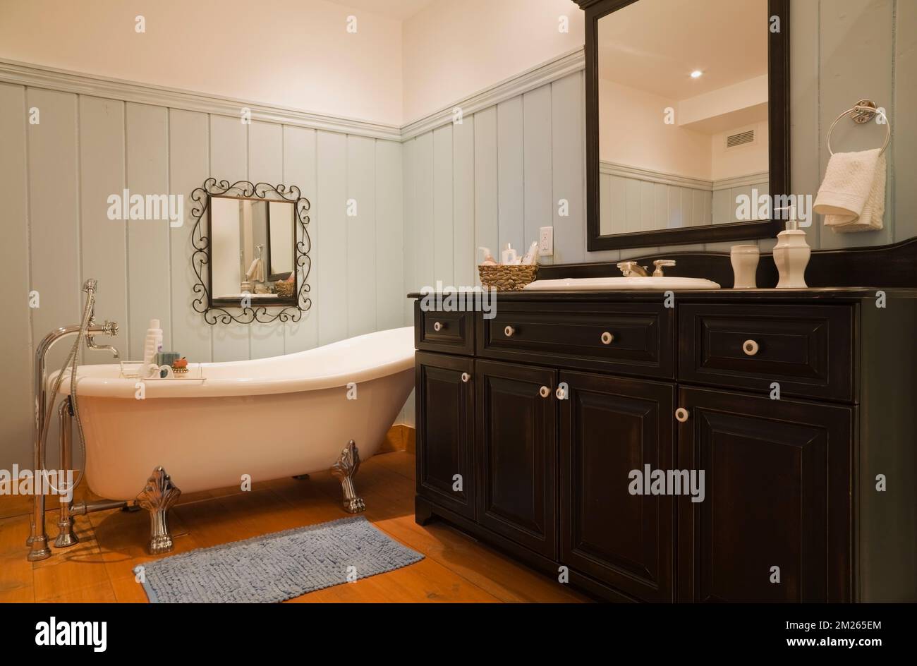 Freestanding claw foot bathtub and vanity in bathroom inside extension ...