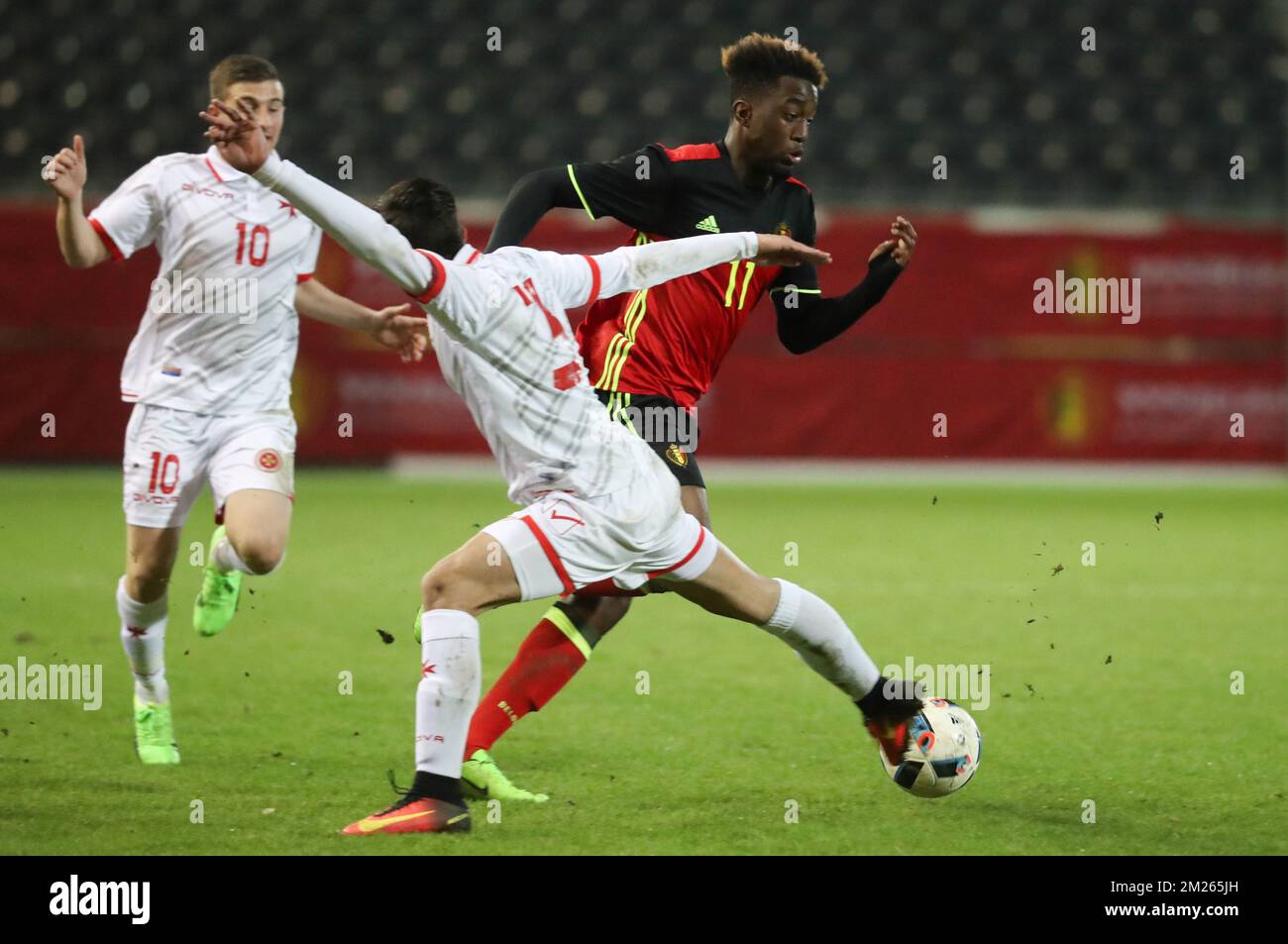 Malta's Kurt Zammit and Belgium's Isaac Mbenza fight for the ball ...
