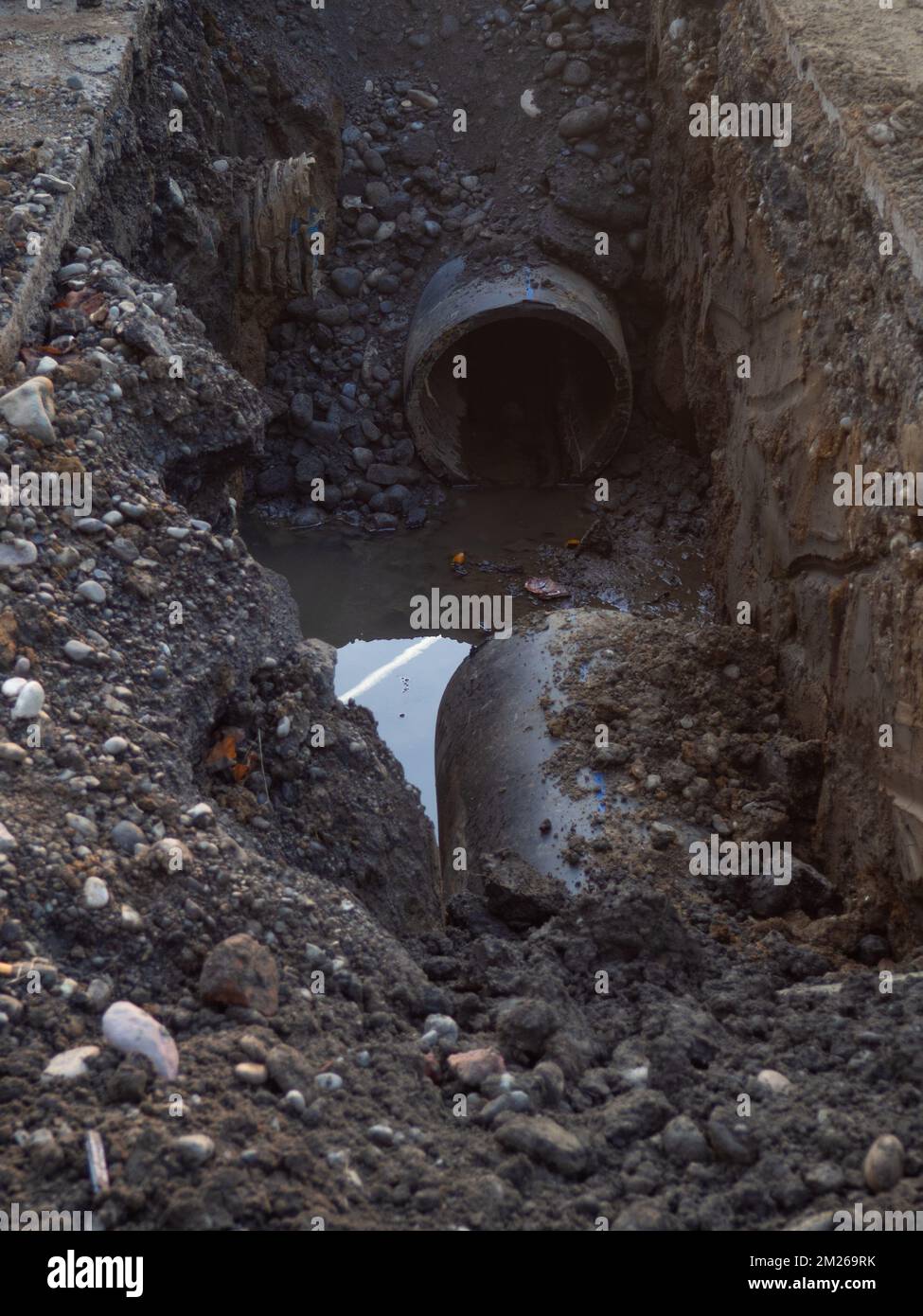 Works on the replacement of sewer pipes. Thick pipes underground ...