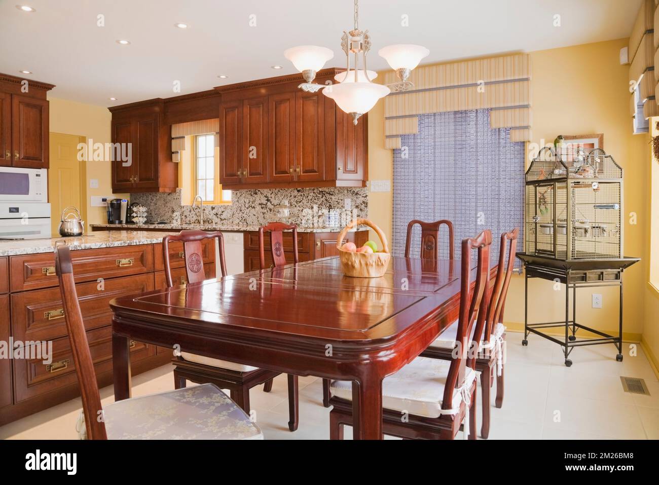 Contemporary brown stained kitchen cabinets and island with nuanced ...