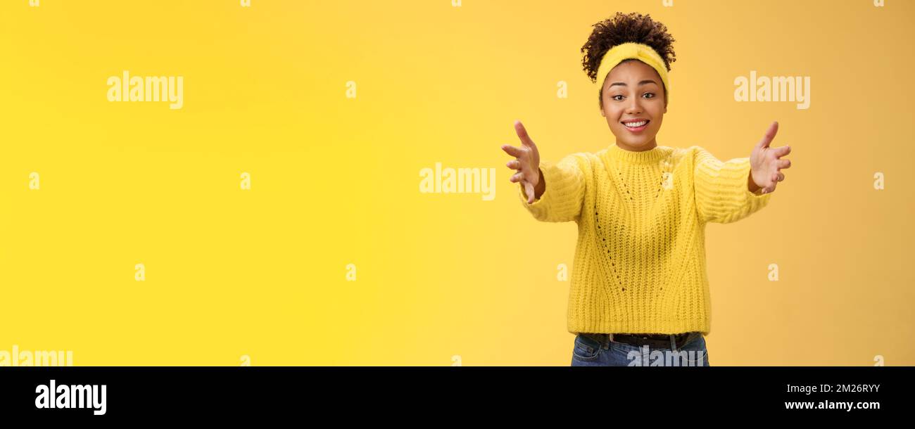 Come closer let me hug you. Touched lovely glad african-american young ...