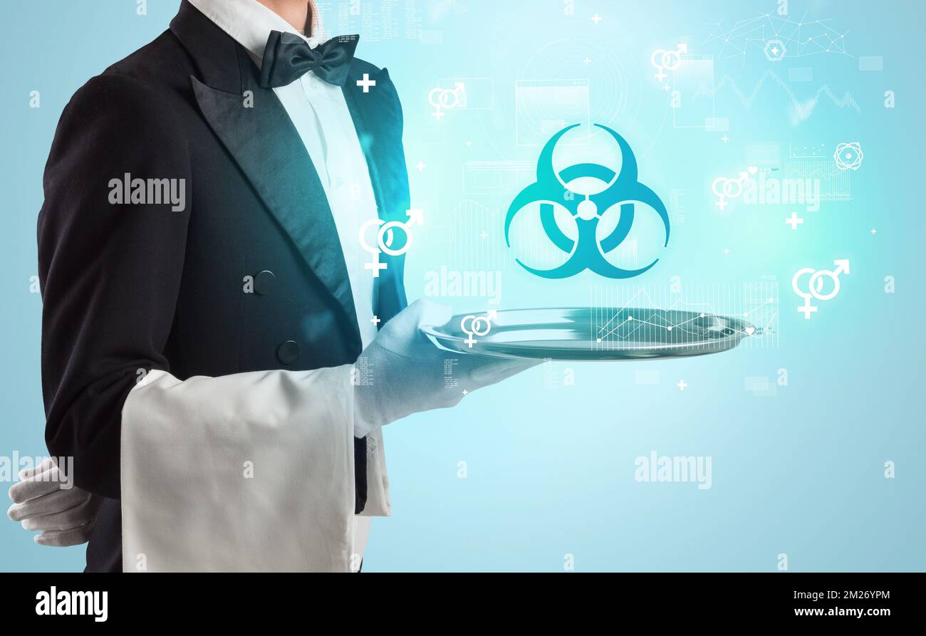 Handsome young waiter in tuxedo holding healthcare icons on tray Stock ...