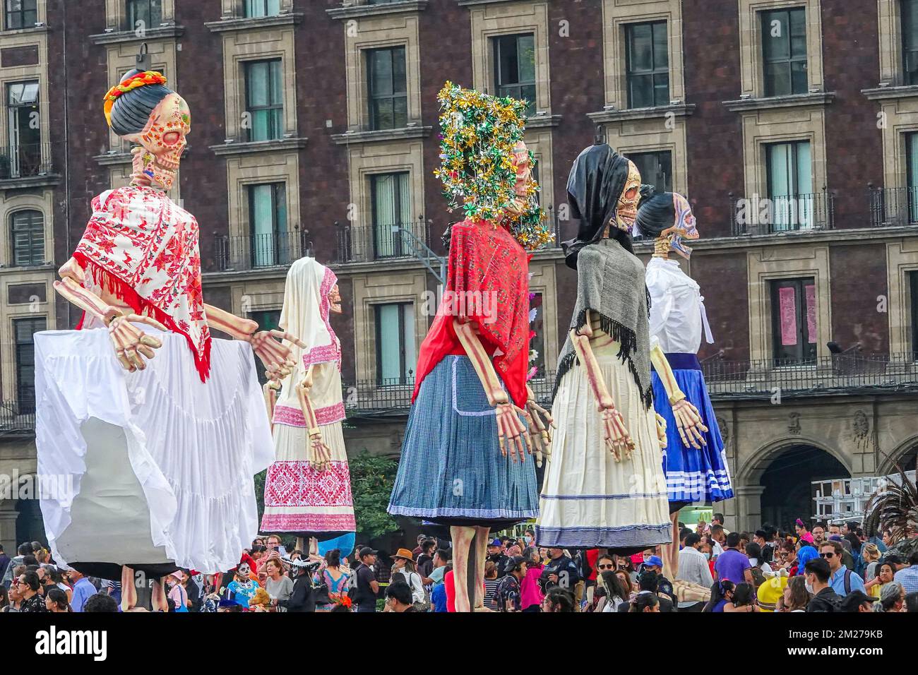 Crowds gather around giant sculptures of Catrina, the skeleton bride ...