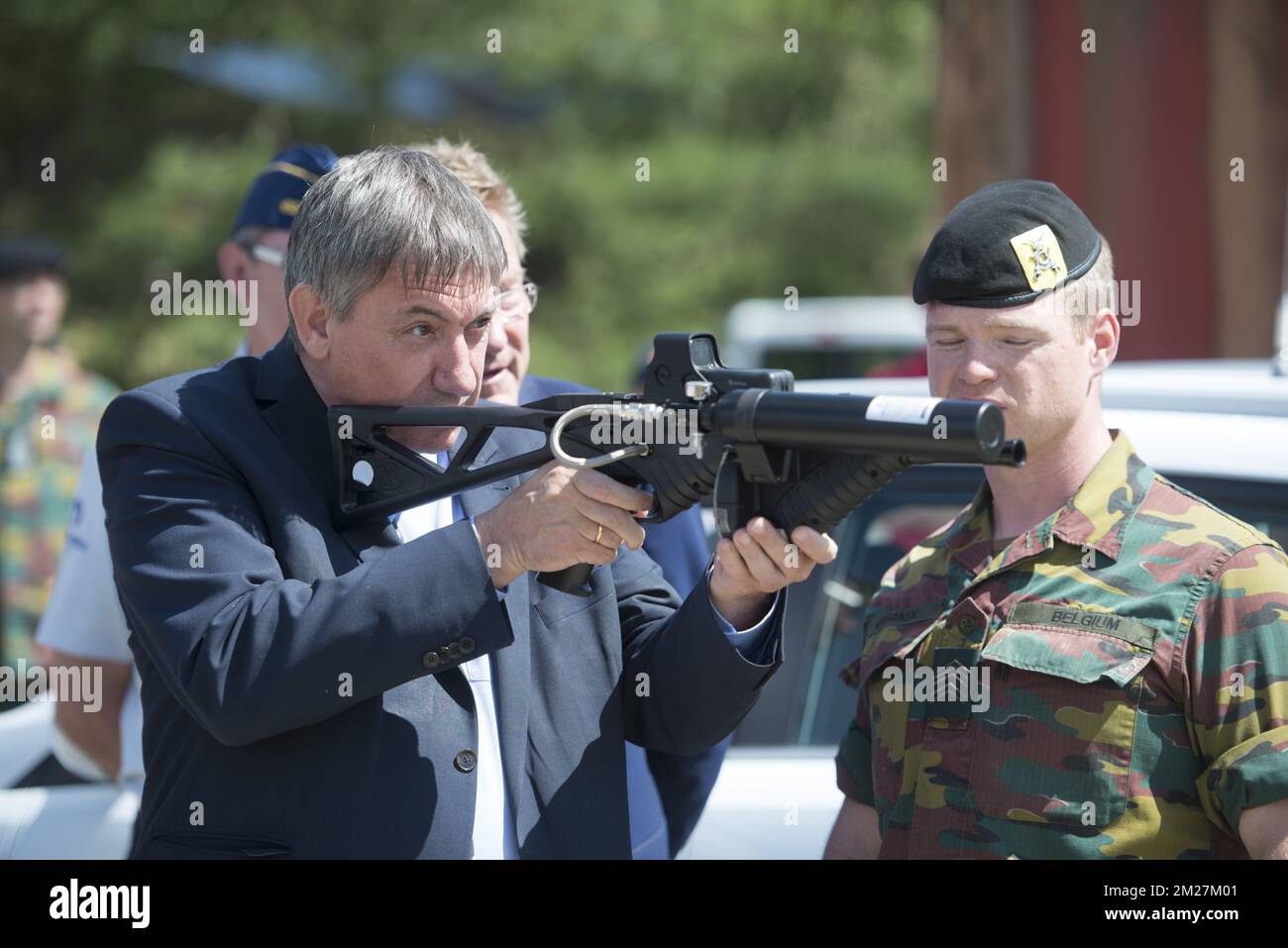Vice-Prime Minister and Interior Minister Jan Jambon holds an FN 303 ...