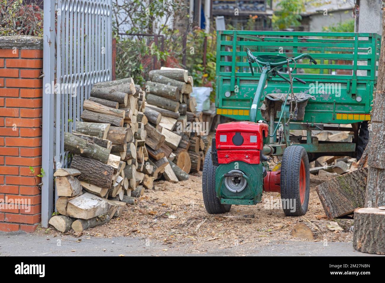 Two Wheeled Tractor With Trailer for Transport Firewood Stock Photo - Alamy