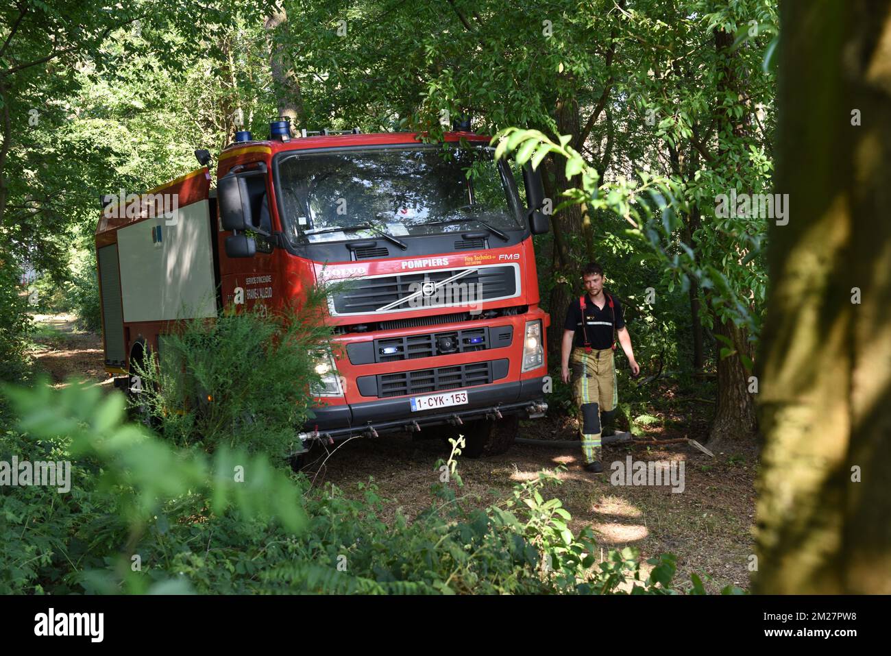Firemen pictured as a fire started earlier today in the Villers wood in ...