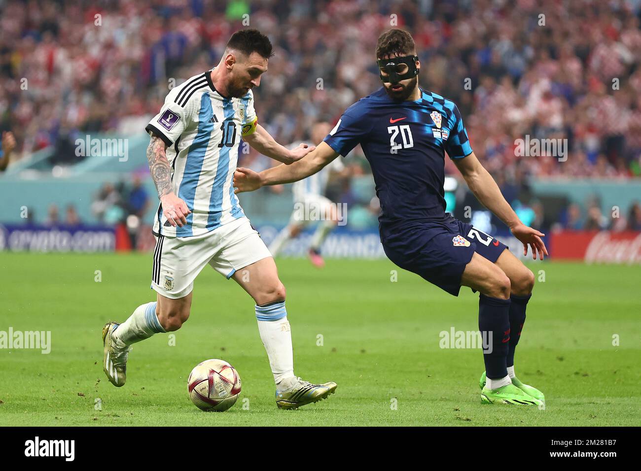 Doha, Qatar. 13th Dec, 2022. Lionel Messi (L) of Argentina in action ...