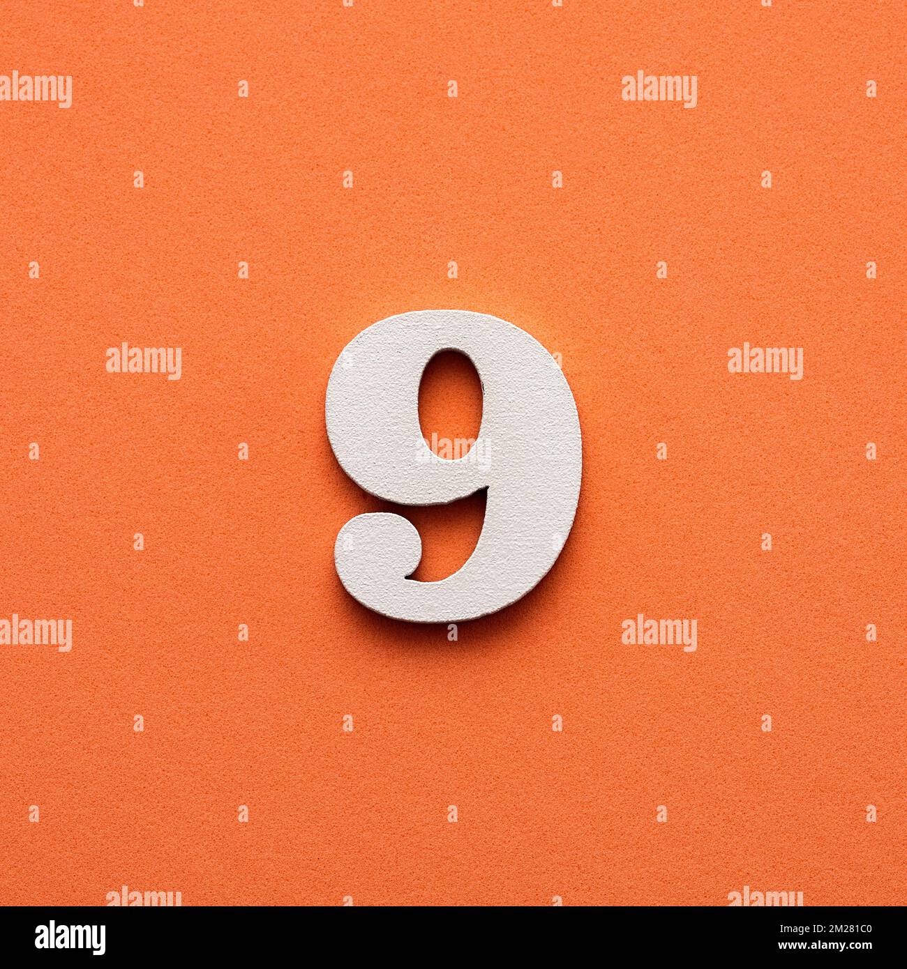 Number 9 - White wooden number on pink background Stock Photo - Alamy