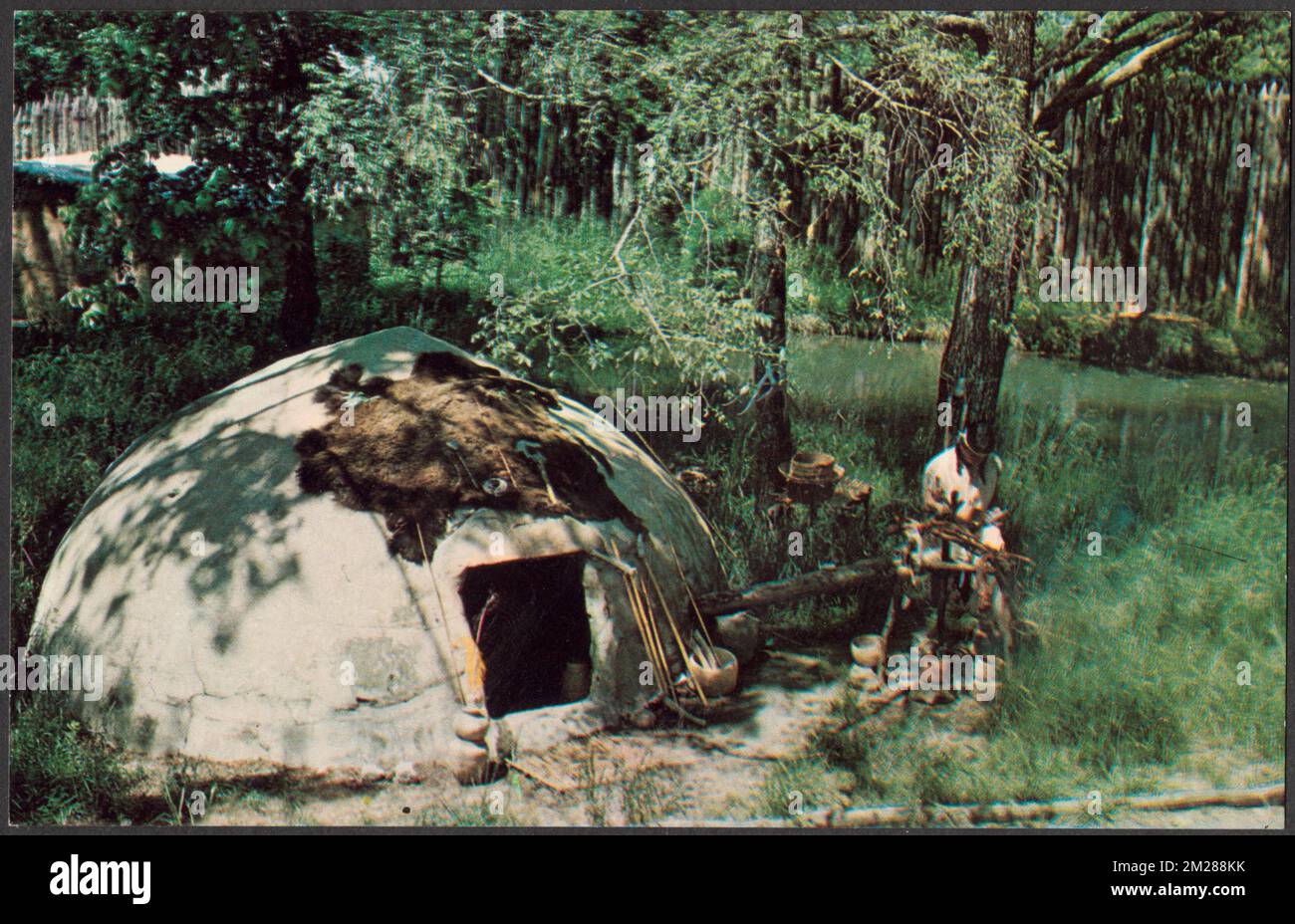 A Cherokee medicine man or Dida:hnvwi:sg (I) , Houses, Tichnor Brothers ...