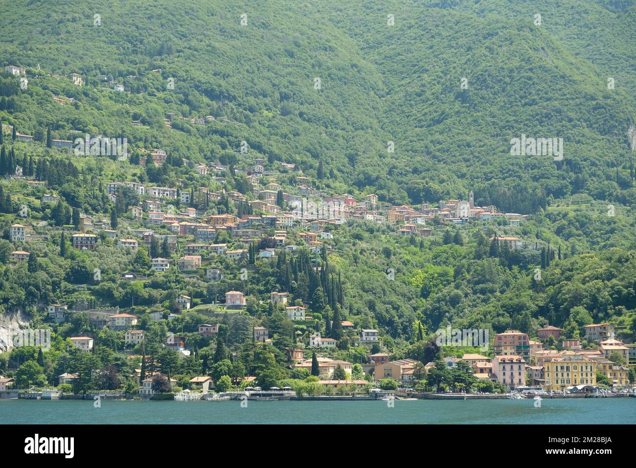 Como Lake landscape. Cernobbio village, trees, water and mountains ...