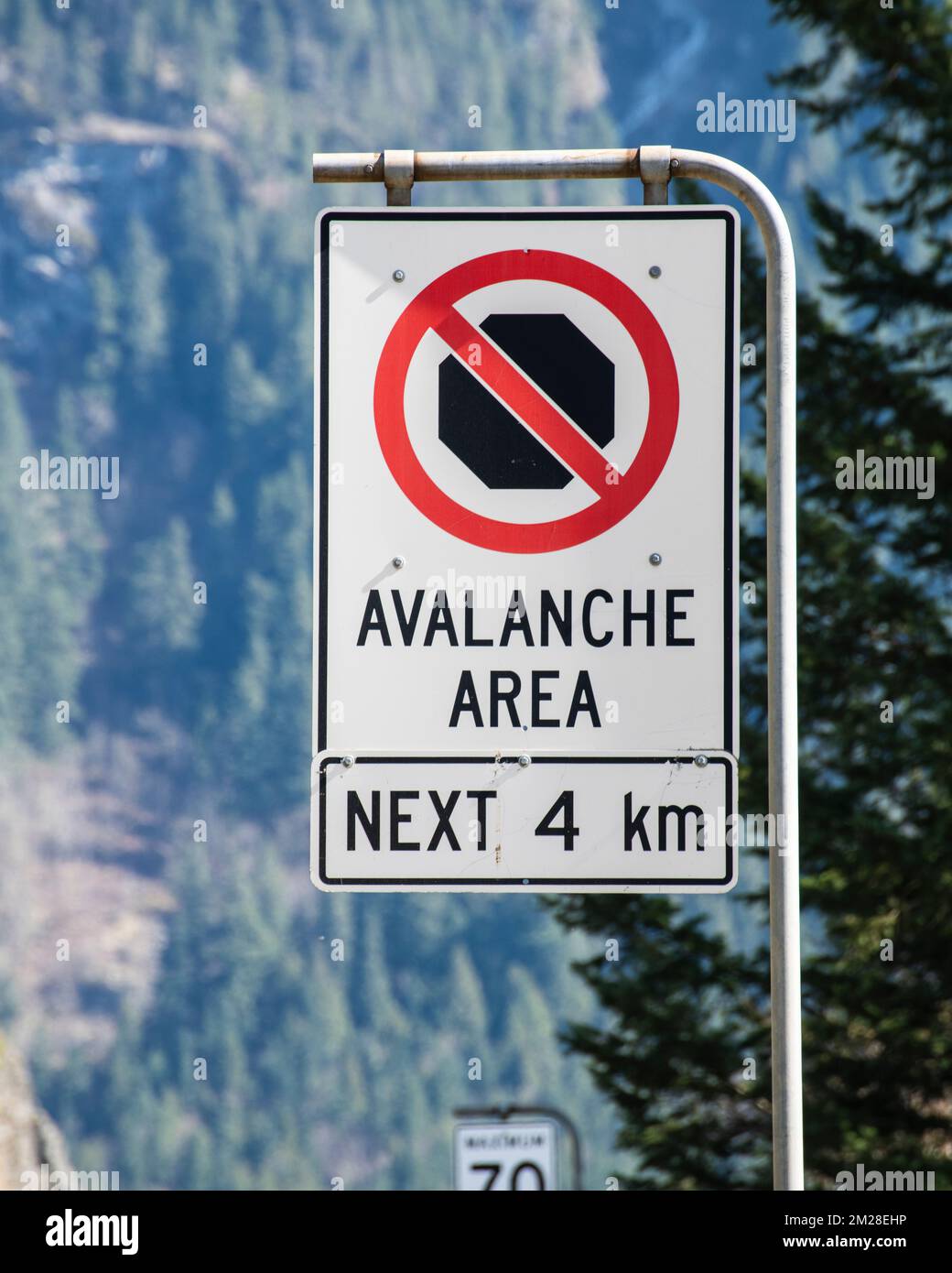 Avalanche area sign at the highway junction in Hope, British Columbia ...