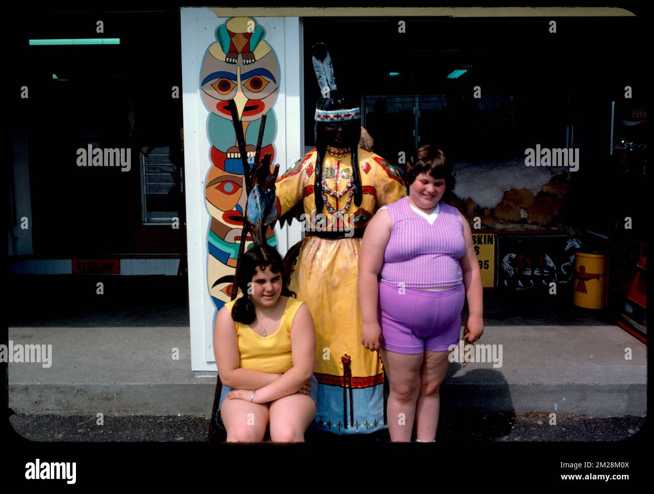 Children posing with statue of Native American, Mohawk Tepee souvenir ...