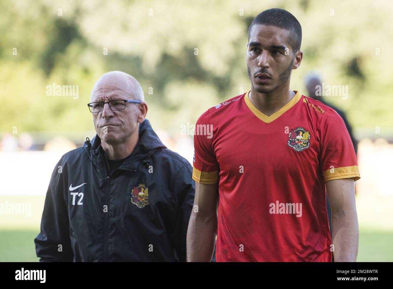 Tubize's assistant coach Michel De Wolf and Tubize's Ayoub Ben Yaghlane ...