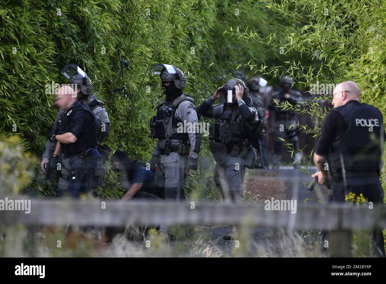 Police pictured on the scene of a hostage situation in Wanze, Wednesday ...