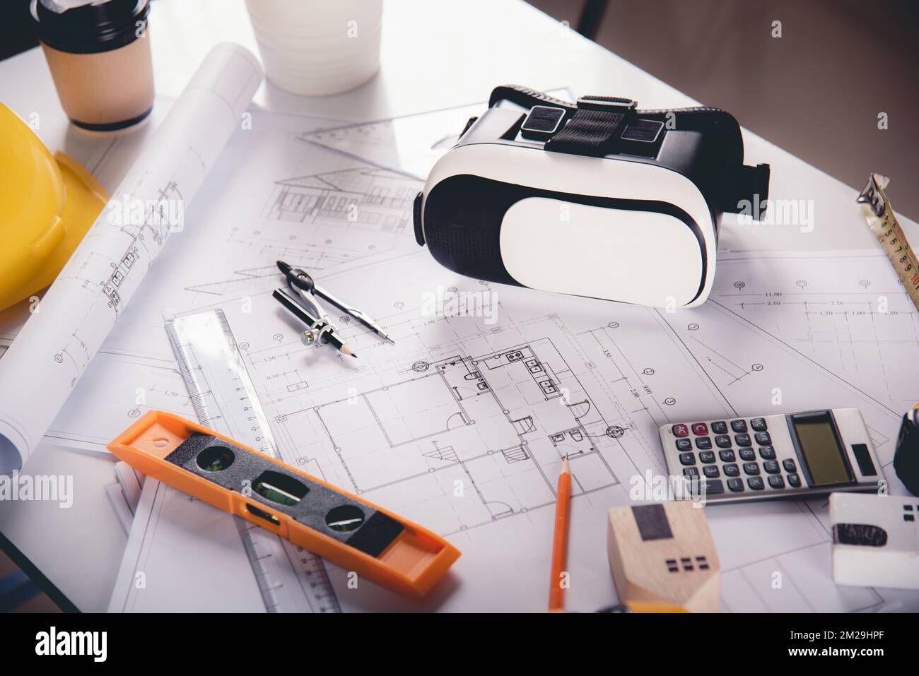 Architectural blueprint paper project plans on desk table Stock Photo ...