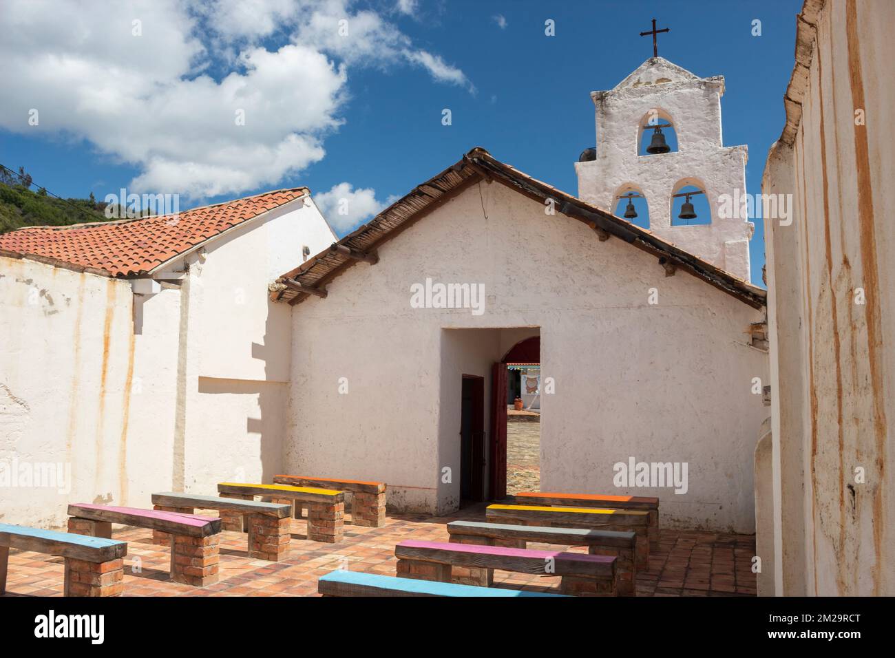 Beautiful antique church without roof and concrete seats at sunny day ...