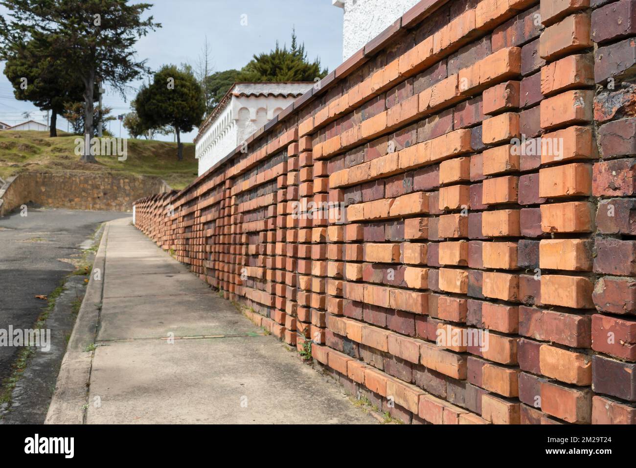 GUATAVITA, COLOMBIA - Closeup to a indigenous pattern into a brick wall ...