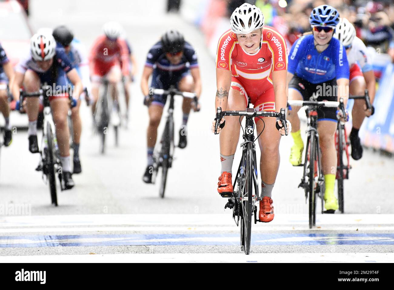 Danish Emma Cecilie Norsgaard Jorgensen crosses the finish line of the ...