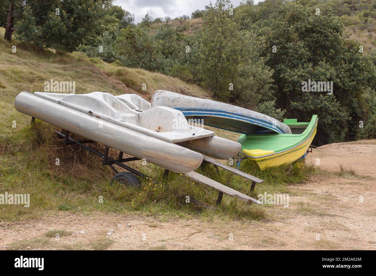 Three old abandoned boats into a forest Stock Photo - Alamy