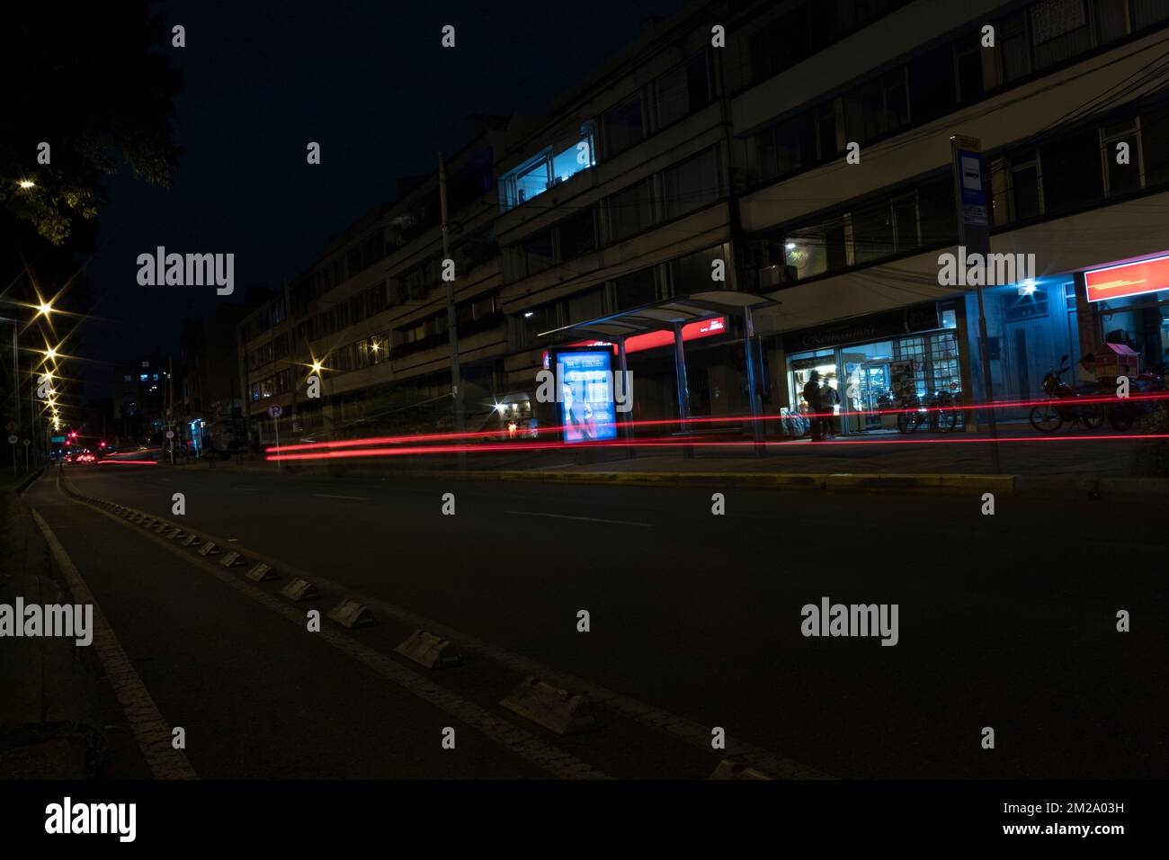 BOGOTA, COLOMBIA SITP bus stop at parkway neighborhood. Night long ...