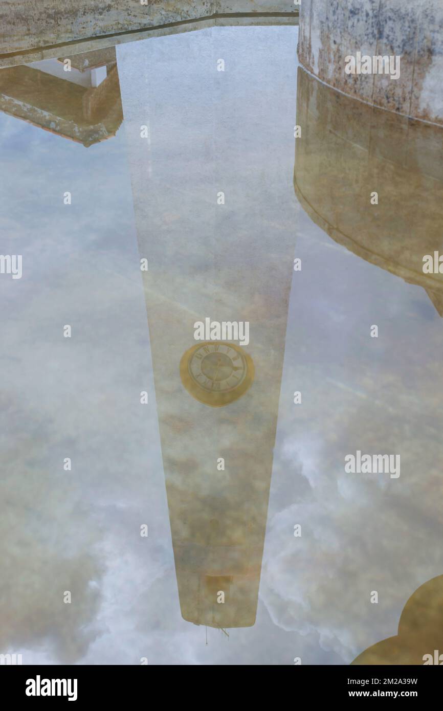 Guatavita clock tower water reflection effect Stock Photo - Alamy