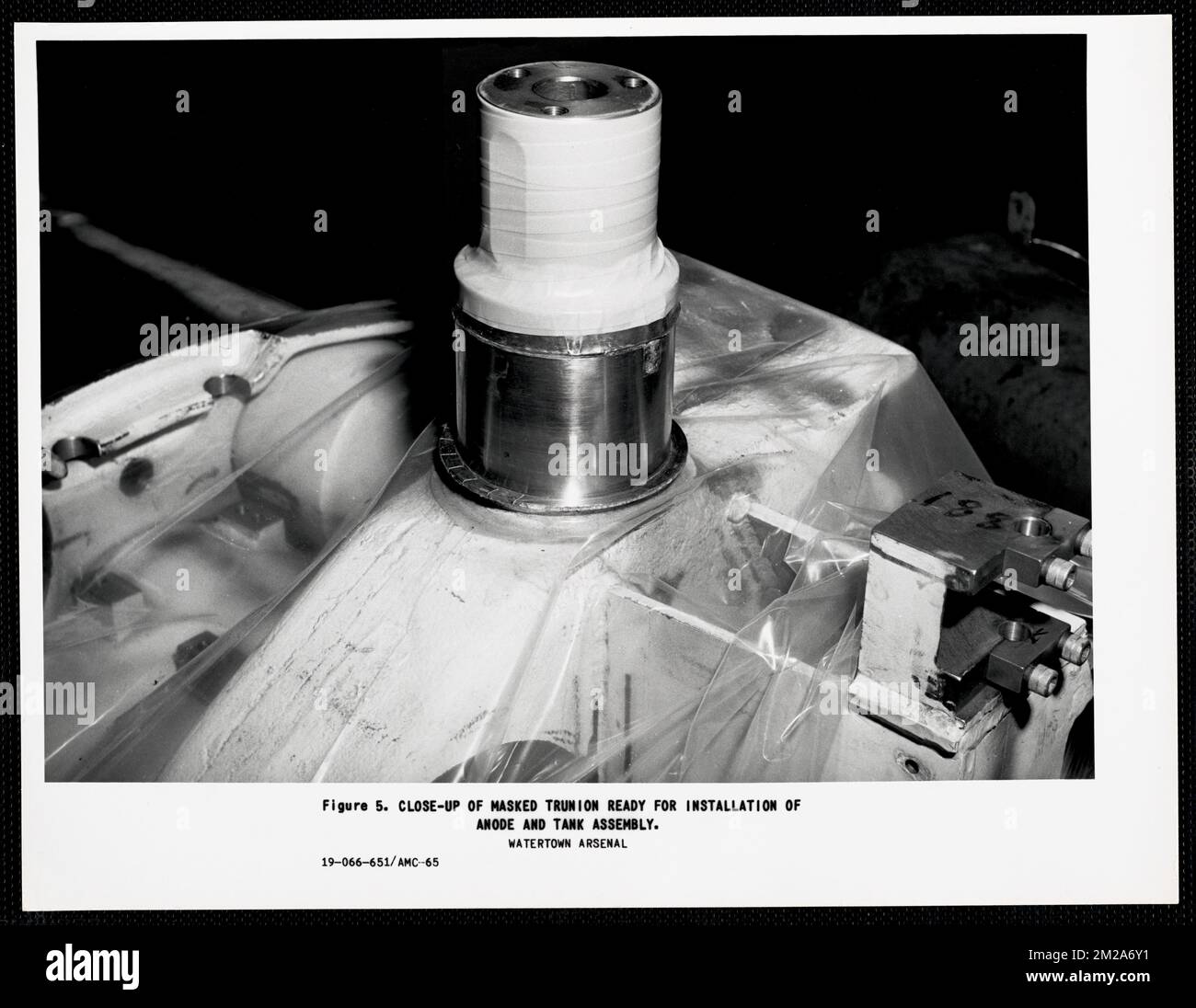 Close-up of masked trunion ready for installation of anode and tank ...