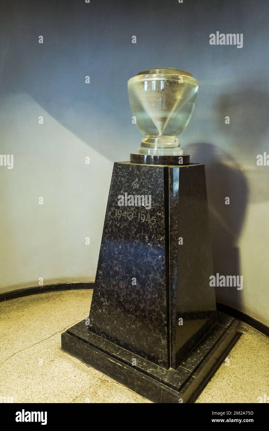 Ashes of Auschwitz prisioners into a metal urn at Auschwitz Birkenau ...