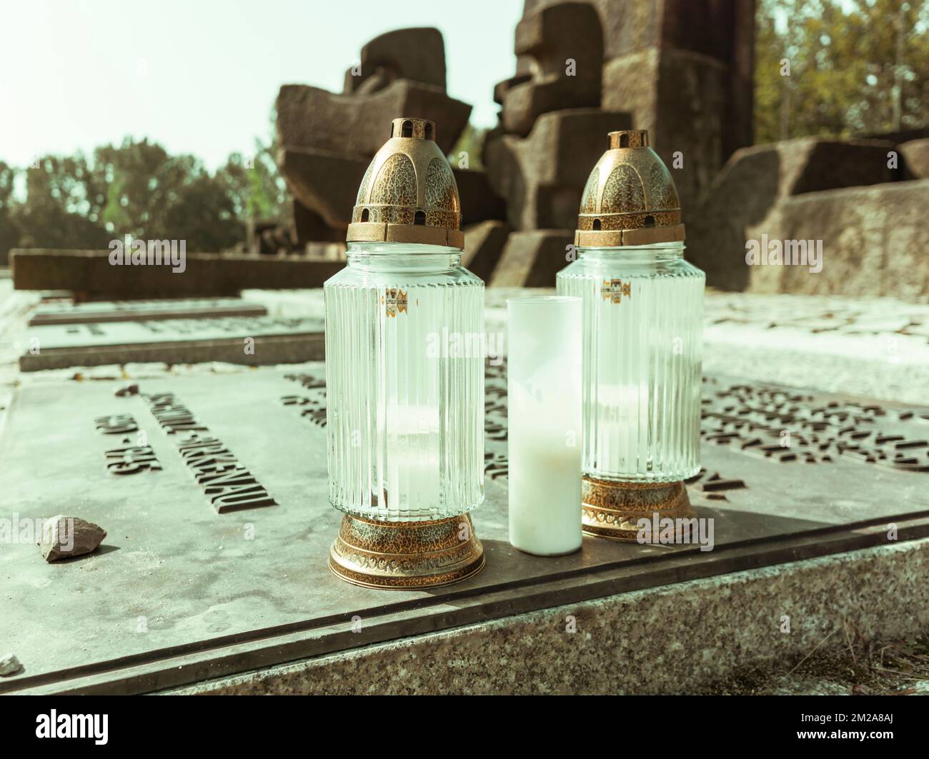 Two Candles over memorial tablet into International Memorial Monument ...
