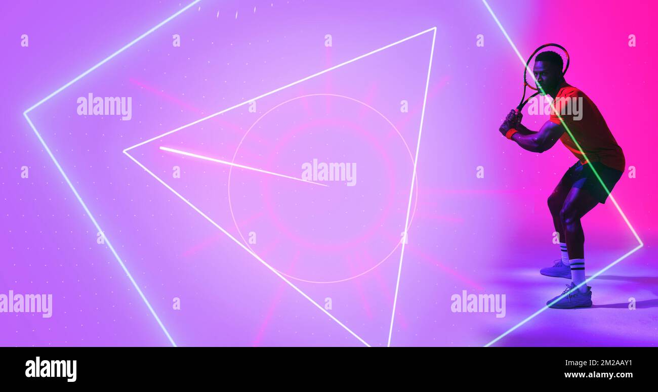 Side view of african american tennis player holding racket by ...