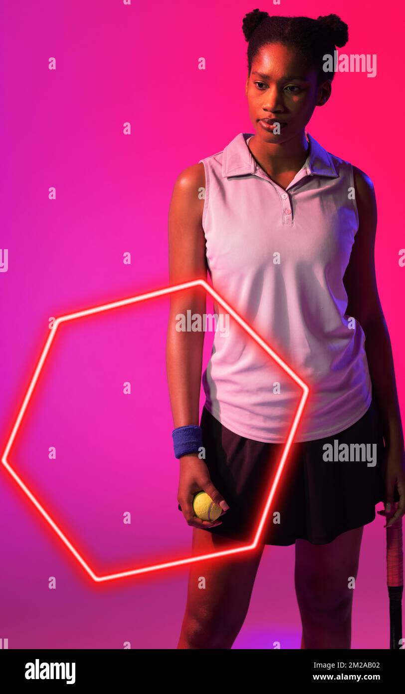 African american female tennis player holding ball and racket by ...