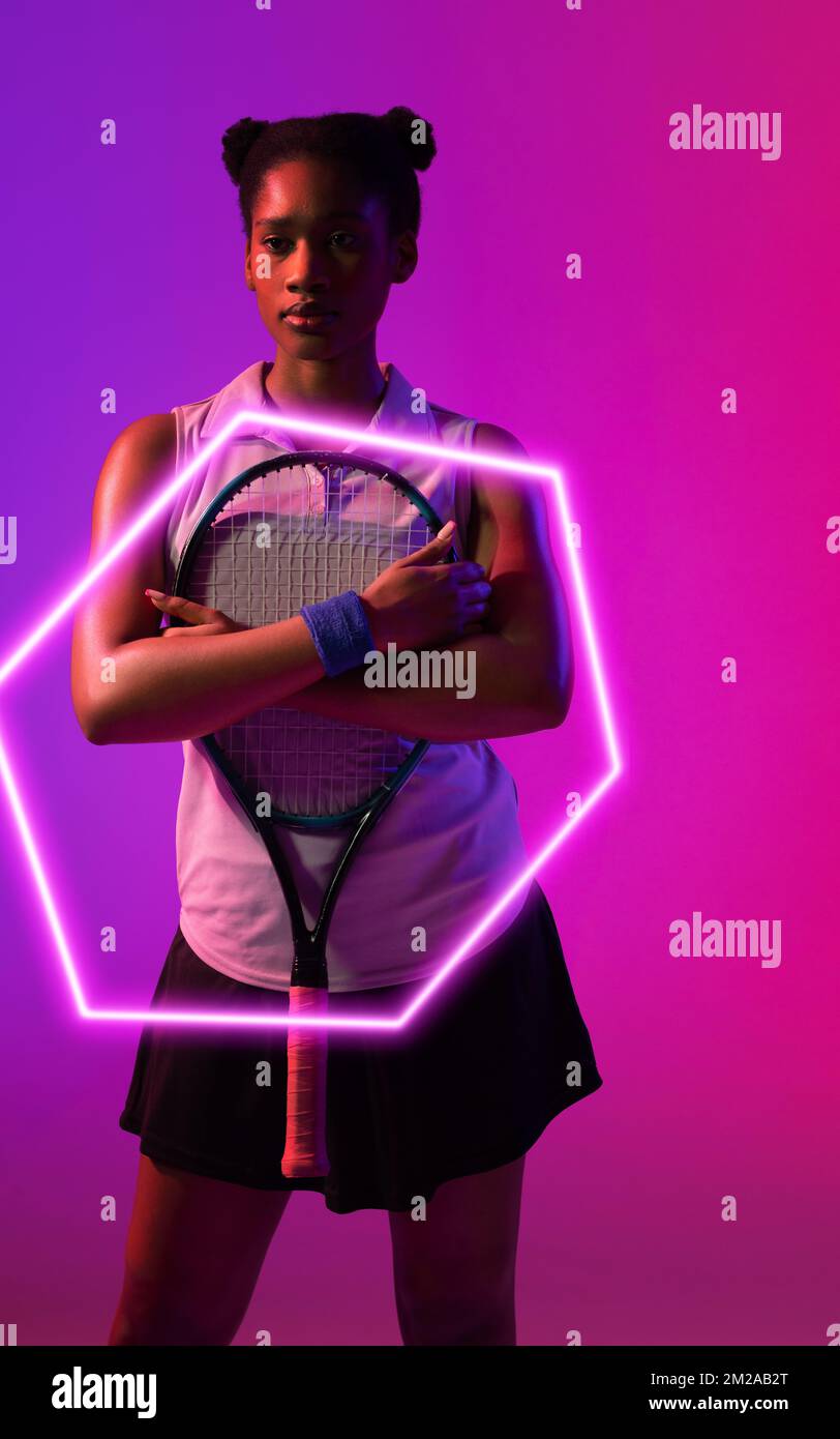 Thoughtful african american female tennis player standing with racket ...