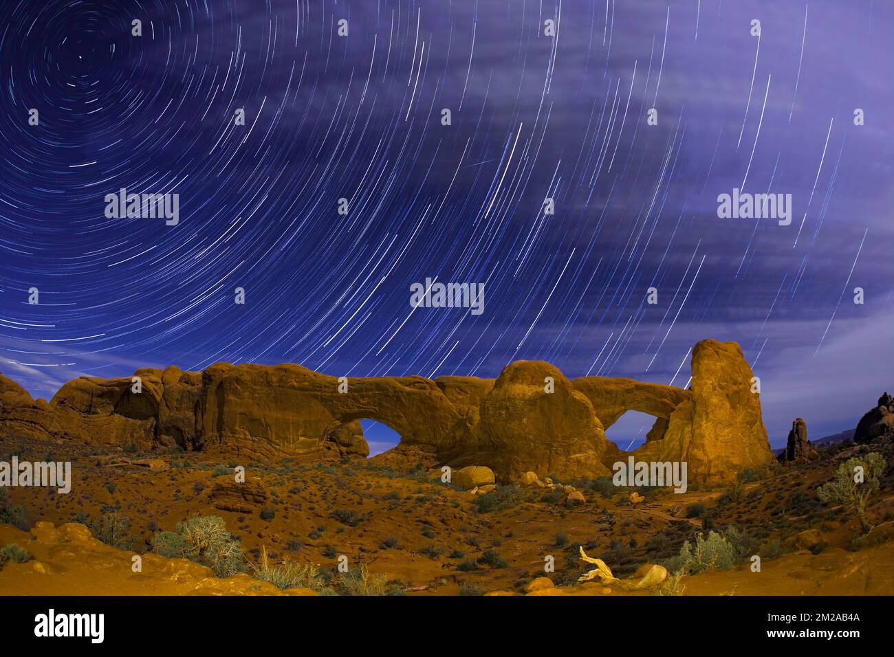 Star trails over the North and South Windows, Utah, USA Stock Photo - Alamy