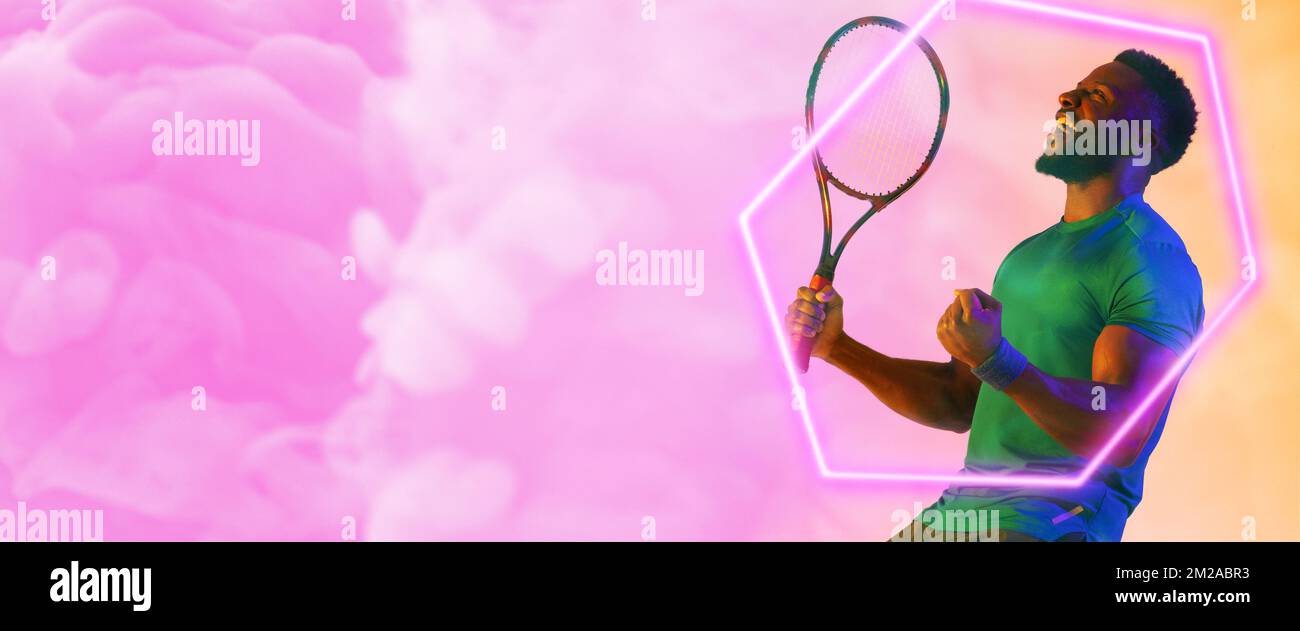 African american male player with racket screaming and shaking hands by ...